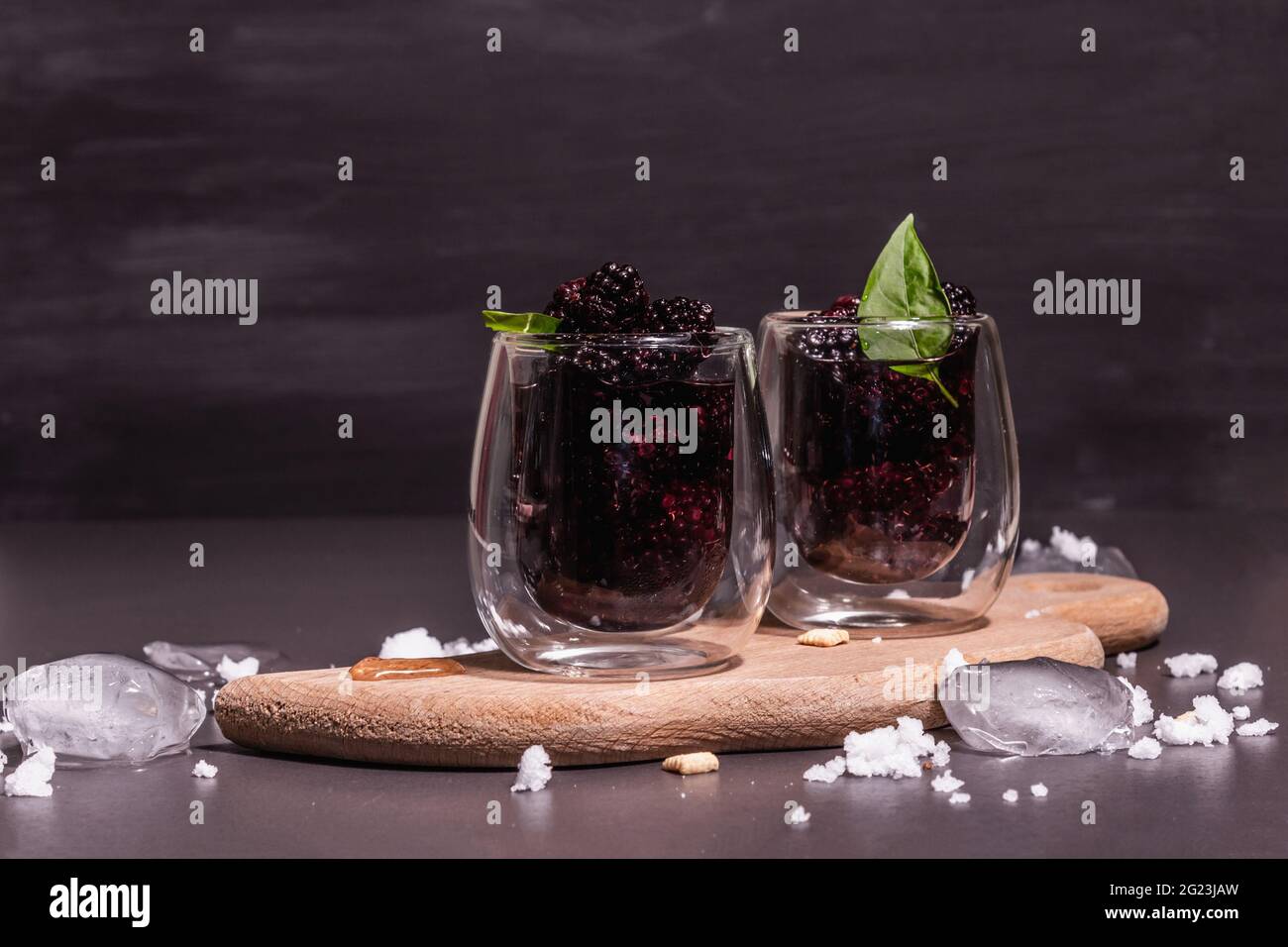 Refreshing blackberry fruit drink. Cold summer berry cocktail, modern ...