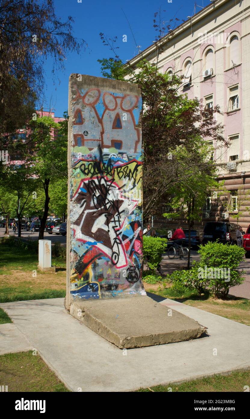 TIRANA, ALBANIA - Apr 10, 2017: Graffiti on tall upright concrete slab ...