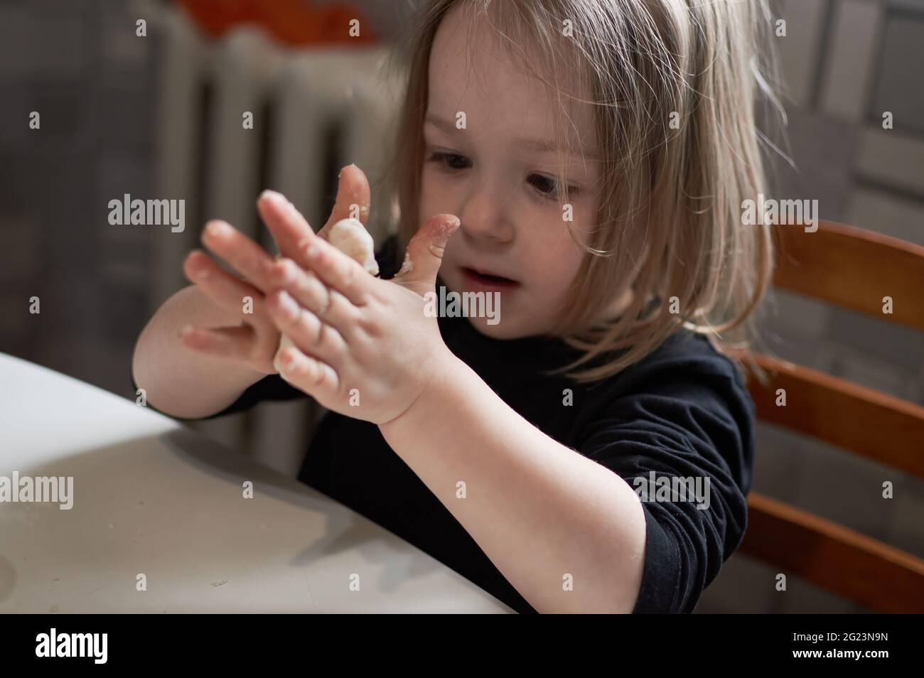 preschool child playing with molding shapes Stock Photo - Alamy