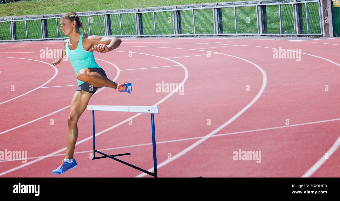 Composition of caucasian female runner over sports field Stock Photo ...