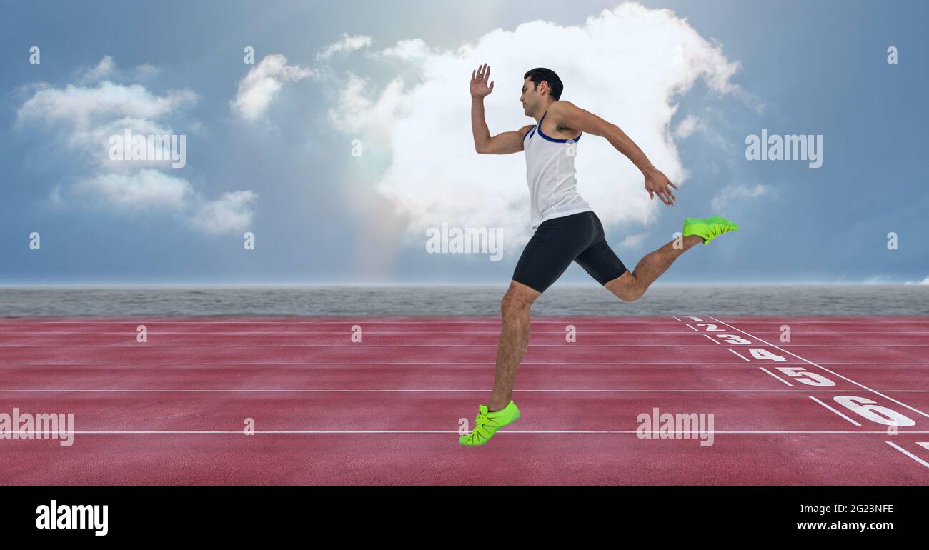 Composition of caucasian male runner over sports field Stock Photo - Alamy