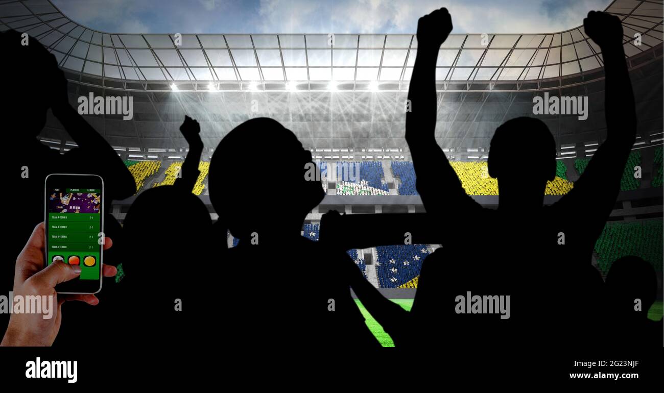 Composition of man using smartphone with sports app over fans at sports ...