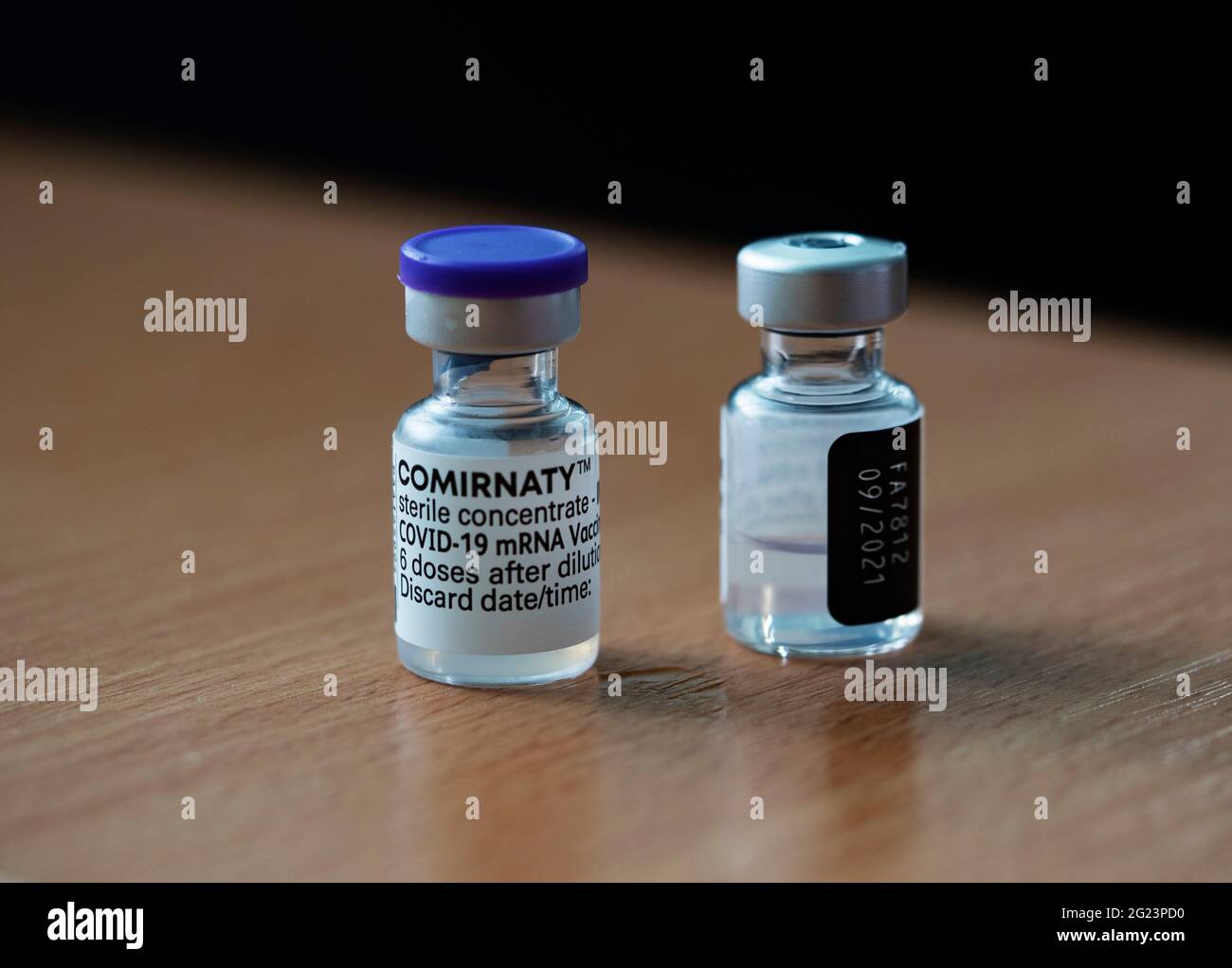 Comirnaty vaccine vial seen on a table. This Covid-19 vaccine is ...
