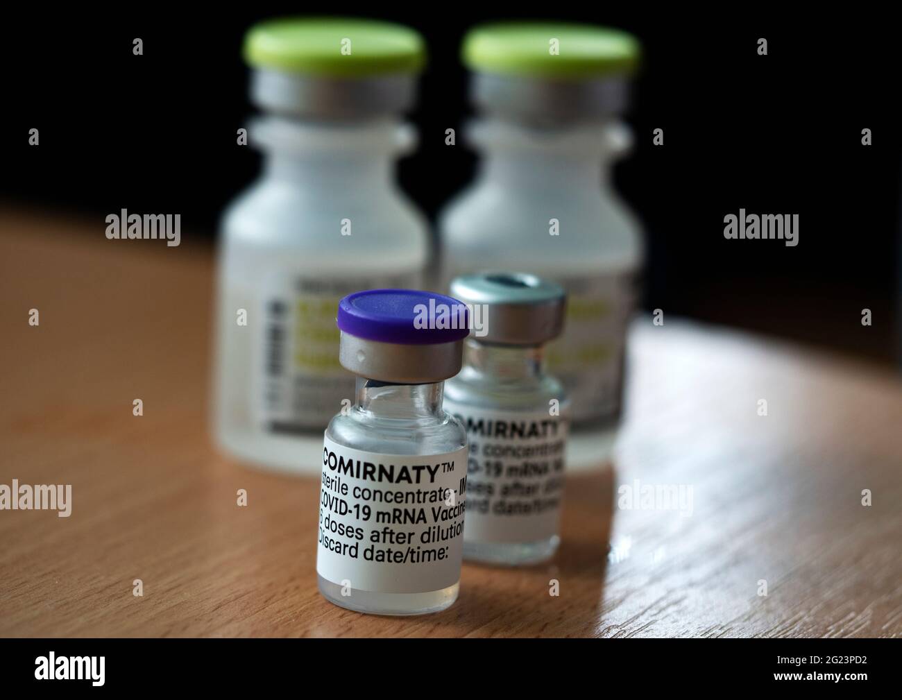 Comirnaty vaccine vial seen on a table. This Covid-19 vaccine is ...