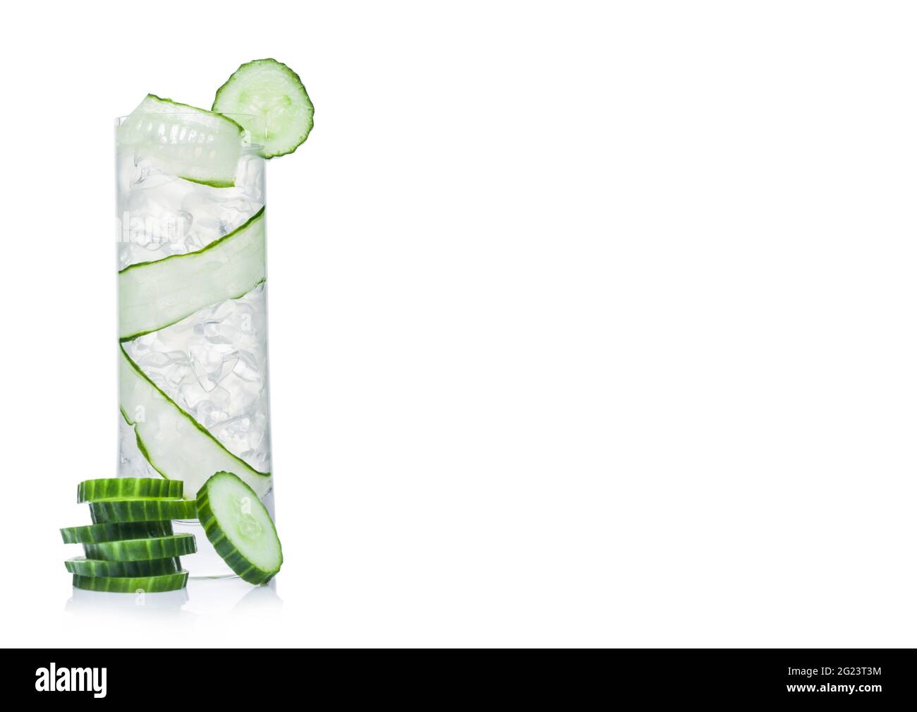 Fresh cold cucumber water in highball glass with ice cubes and cucumber ...