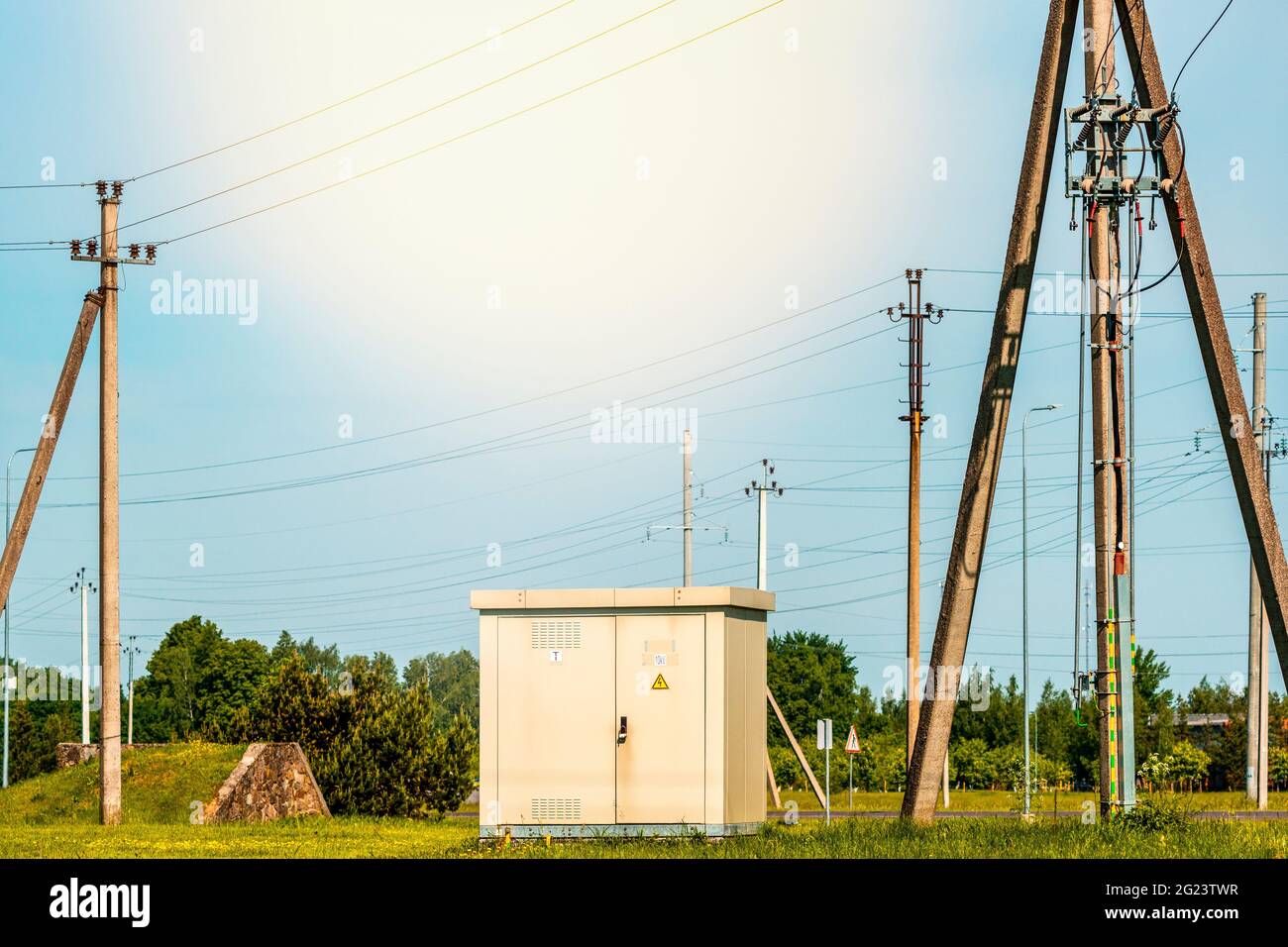 Outdoor electric high voltage cabinet surrounded by power pylons Stock ...