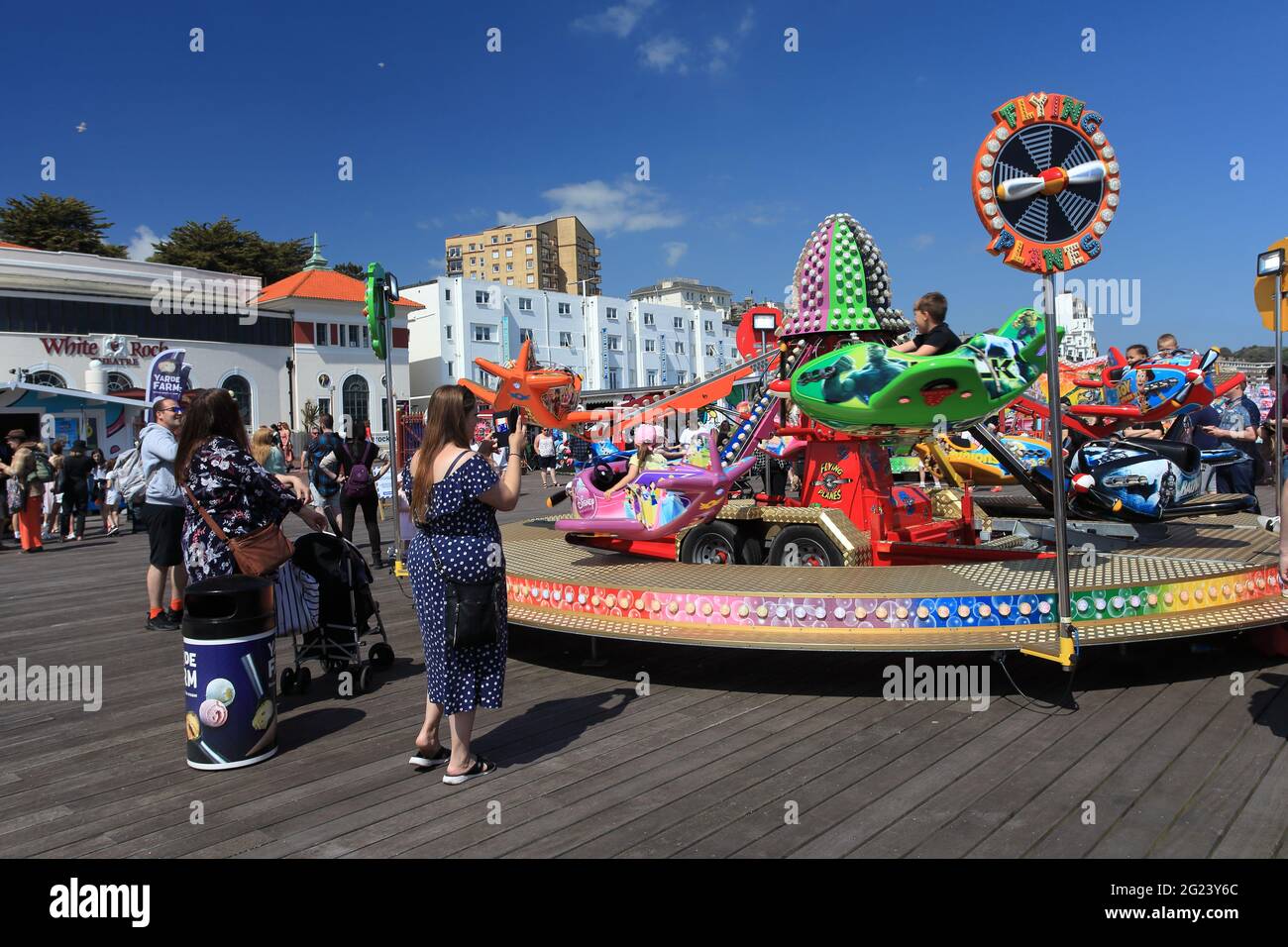 Children enjoying funfair rides on Hastings Pier, Hastings, East Sussex ...