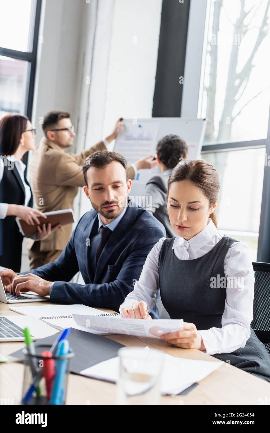 Businesswoman working paper near hi-res stock photography and images ...
