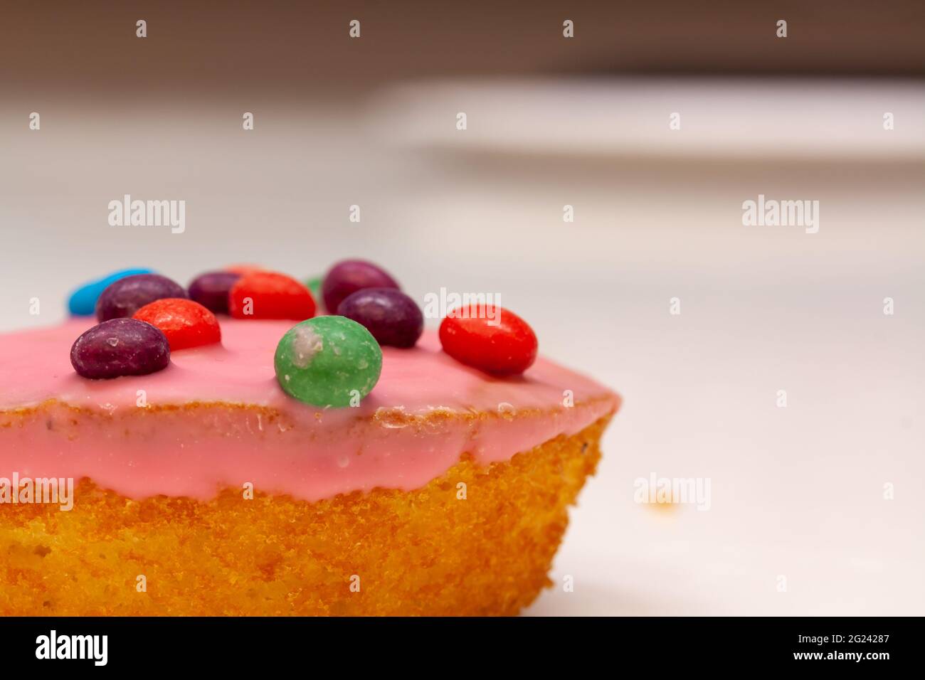 Biscuit with chocolate candies on it on a blurred background Stock ...