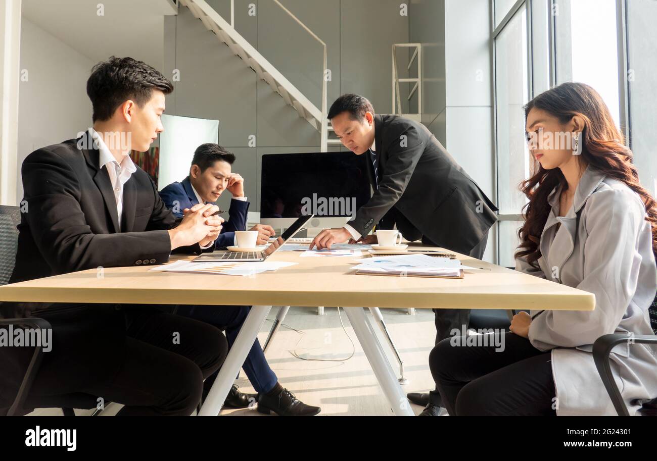 Shot of a group of businesspeople having a discussion in an office ...