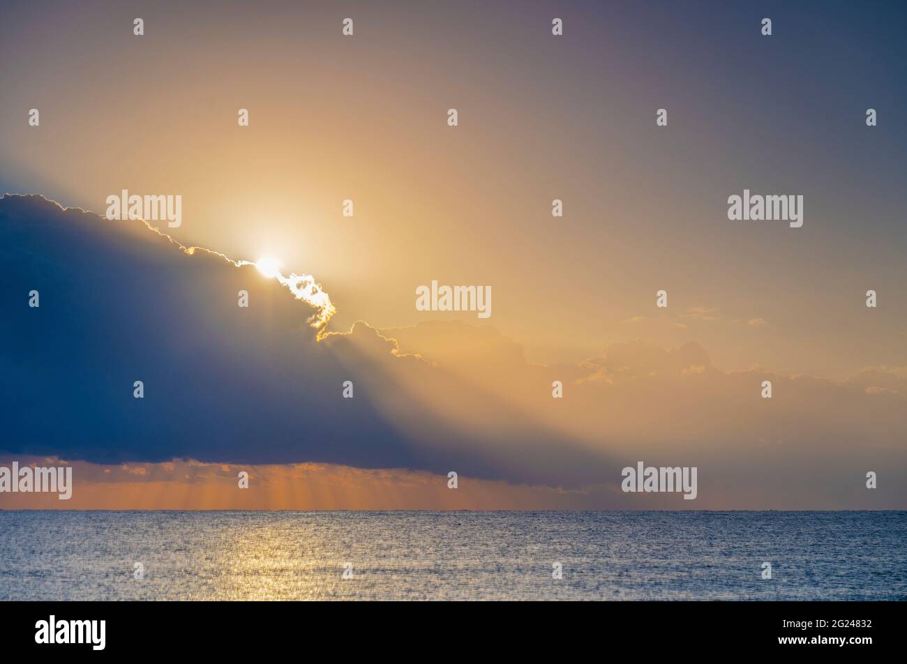 USA, Florida, Boca Raton, Sun rising behind clouds above sea Stock Photo - Alamy