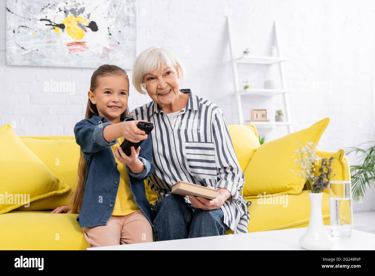 Kid holding remote hi-res stock photography and images - Alamy
