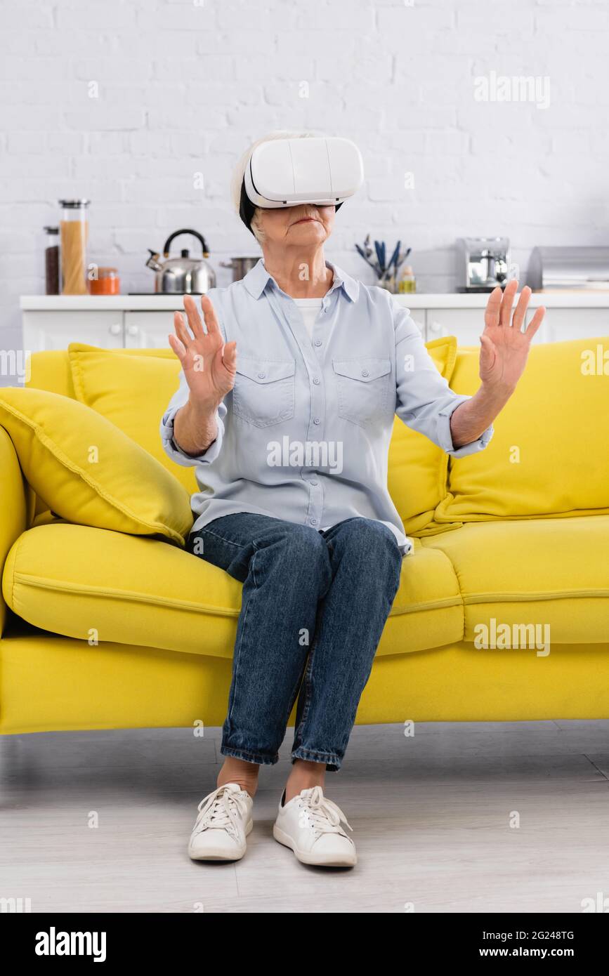 Woman in vr headset sitting hi-res stock photography and images - Alamy