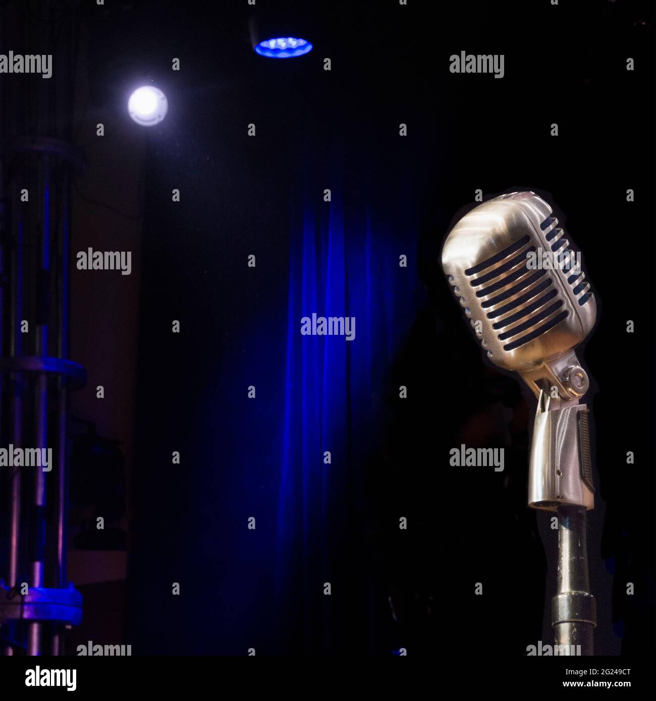 Old fashioned microphone on empty stage Stock Photo - Alamy