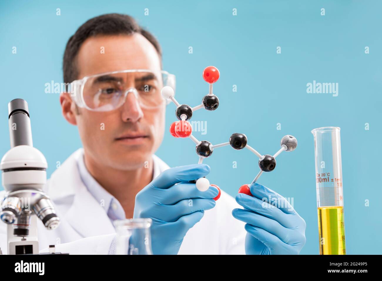 Scientist analyzing molecular model hi-res stock photography and images ...