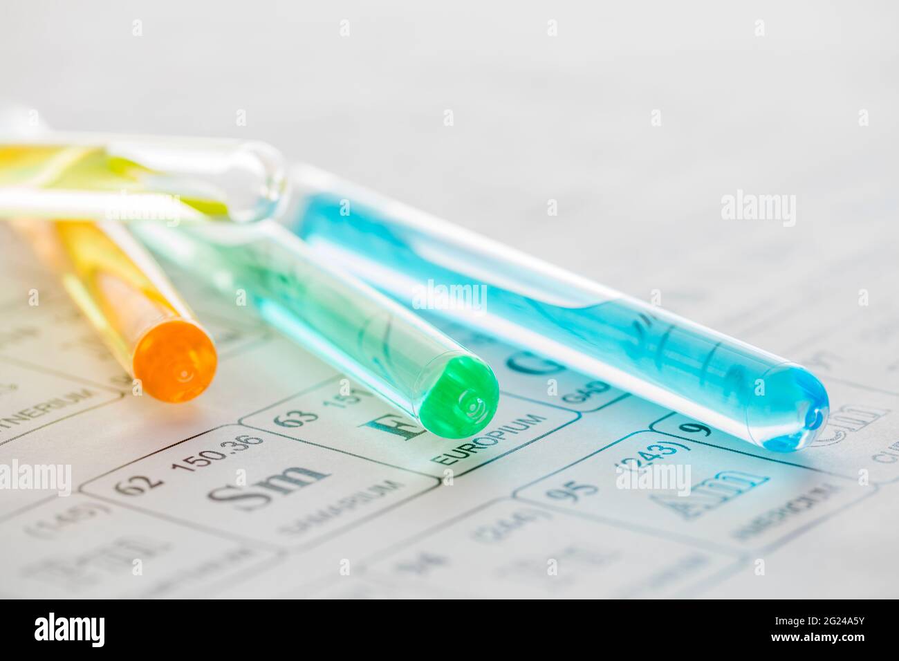 Test tubes with liquids on periodic table Stock Photo - Alamy