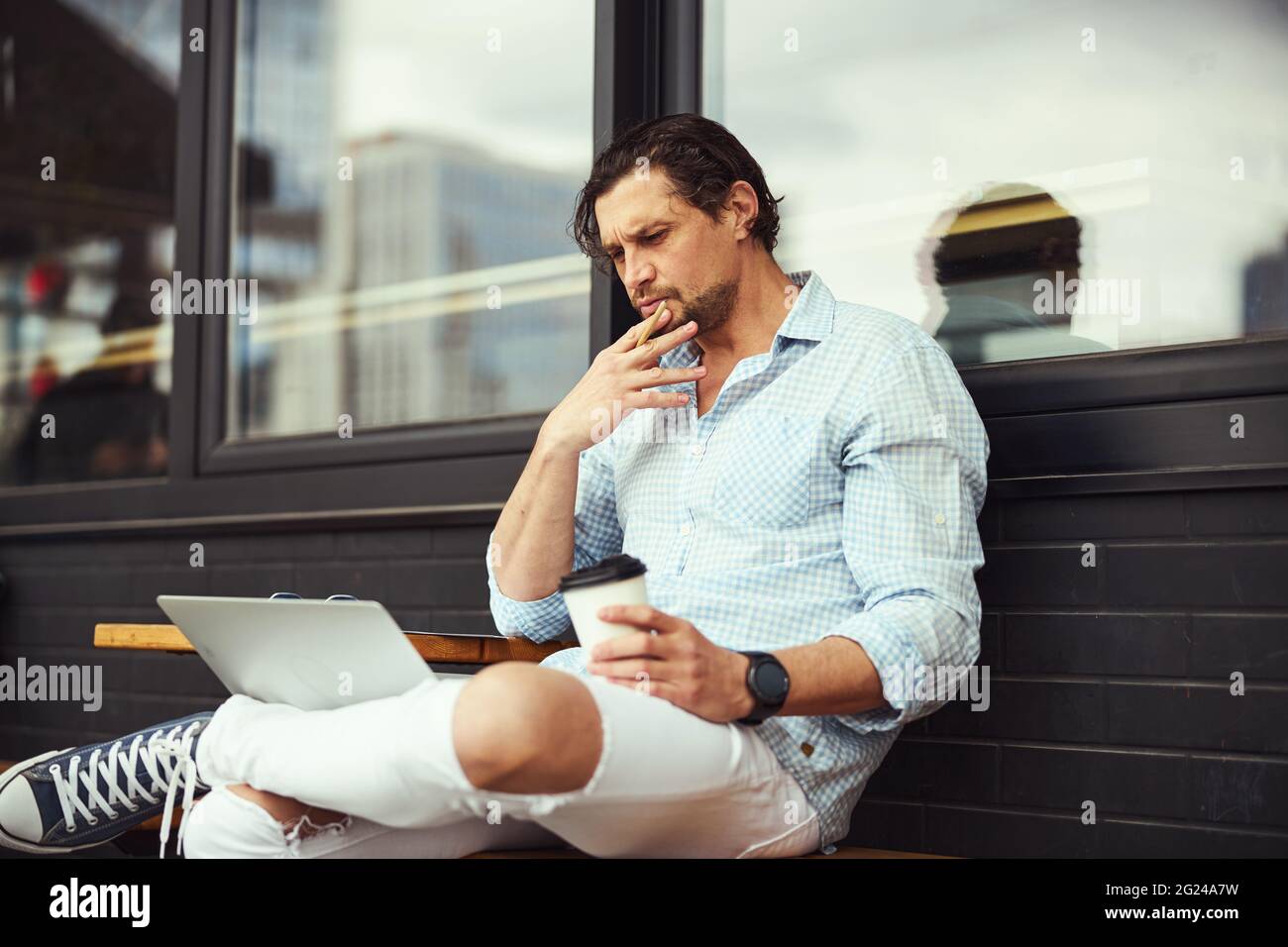 Concentrated male person being deep in thoughts Stock Photo - Alamy