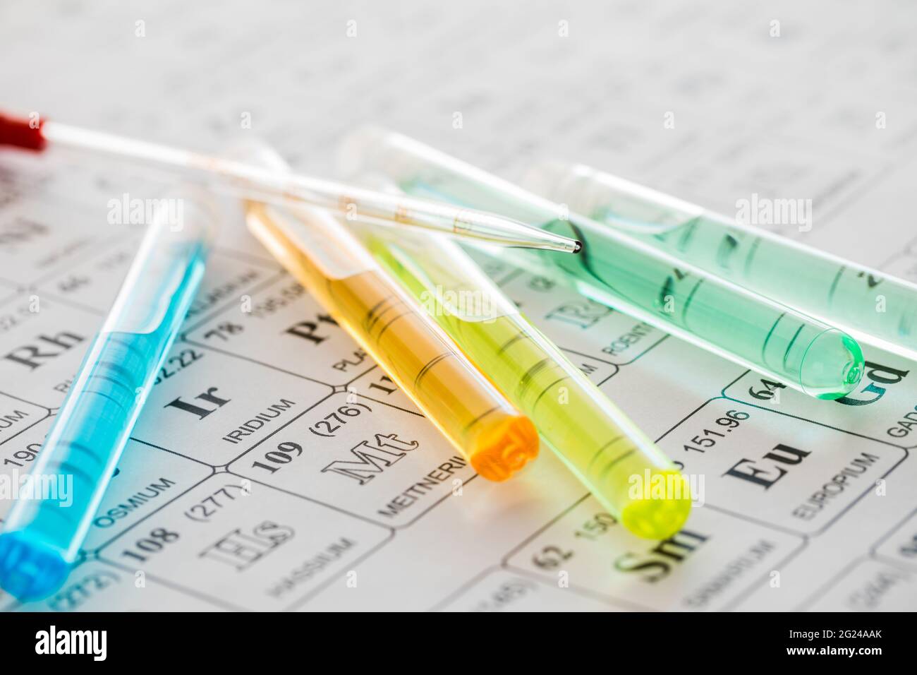 Test tubes with liquids and pipette on periodic table Stock Photo - Alamy