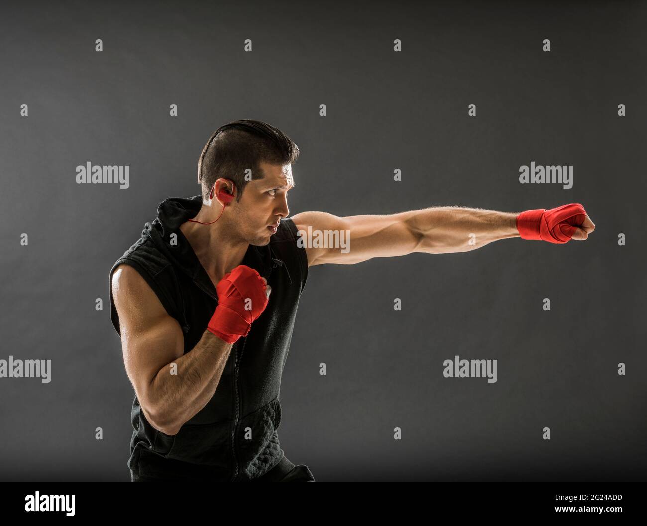 Muscular man training boxing Stock Photo - Alamy