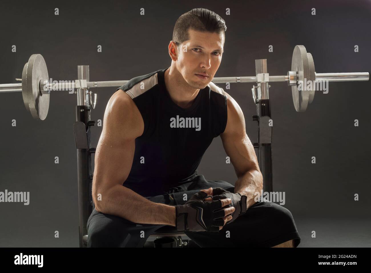 Muscular man training with barbell Stock Photo - Alamy
