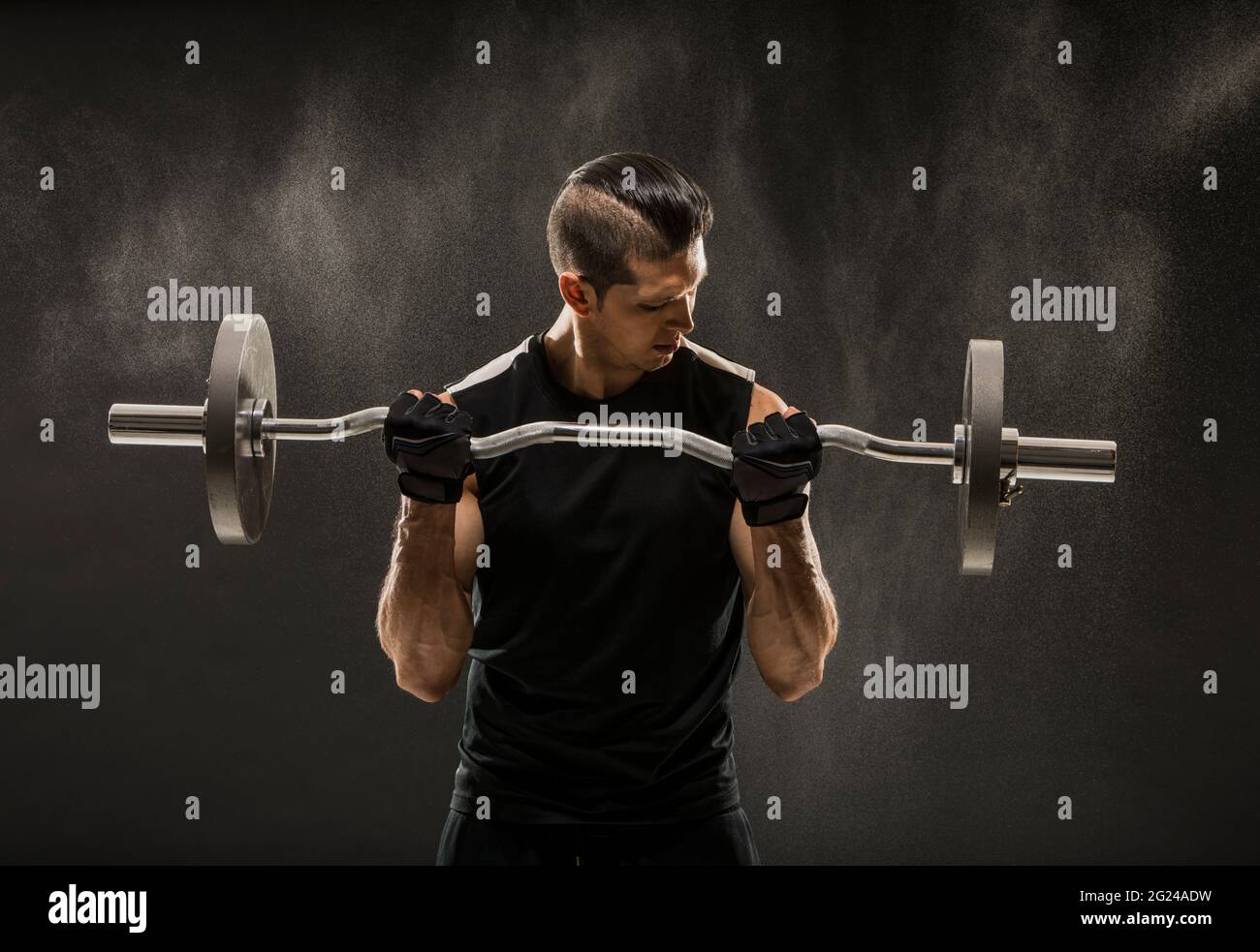 Muscular man training with barbell Stock Photo - Alamy