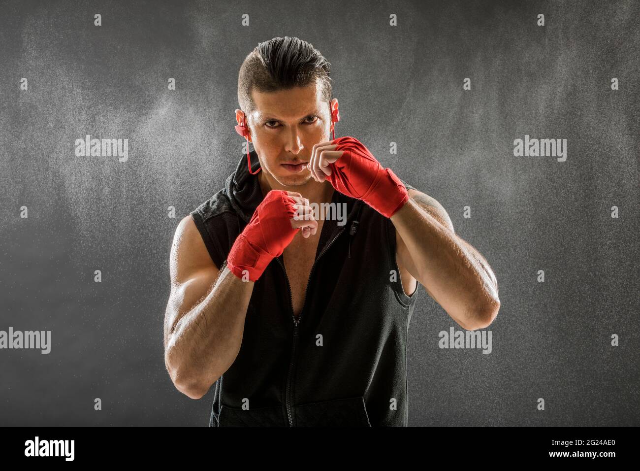Portrait of muscular man in boxing stance Stock Photo - Alamy