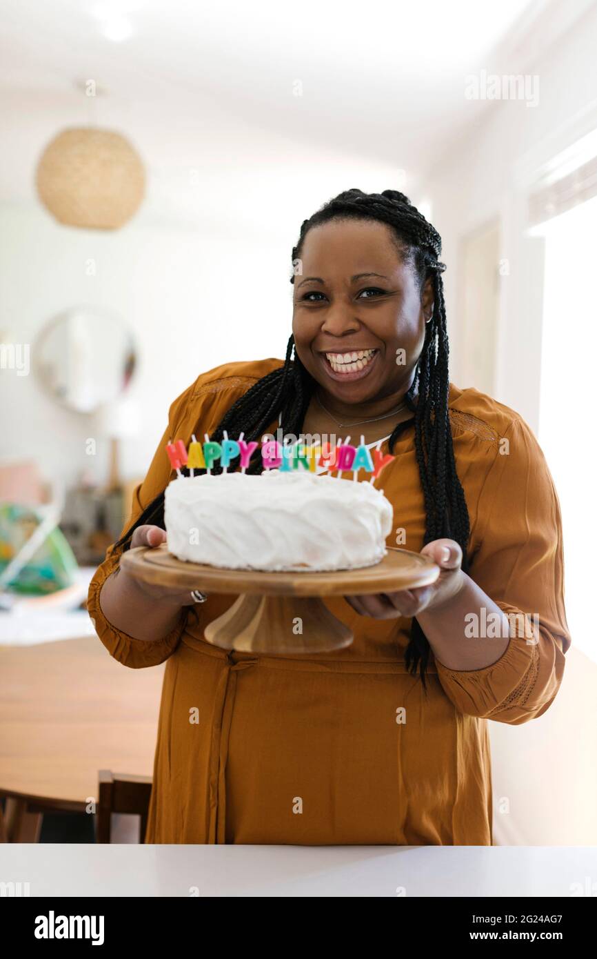 Holding birthday cake hi-res stock photography and images - Alamy