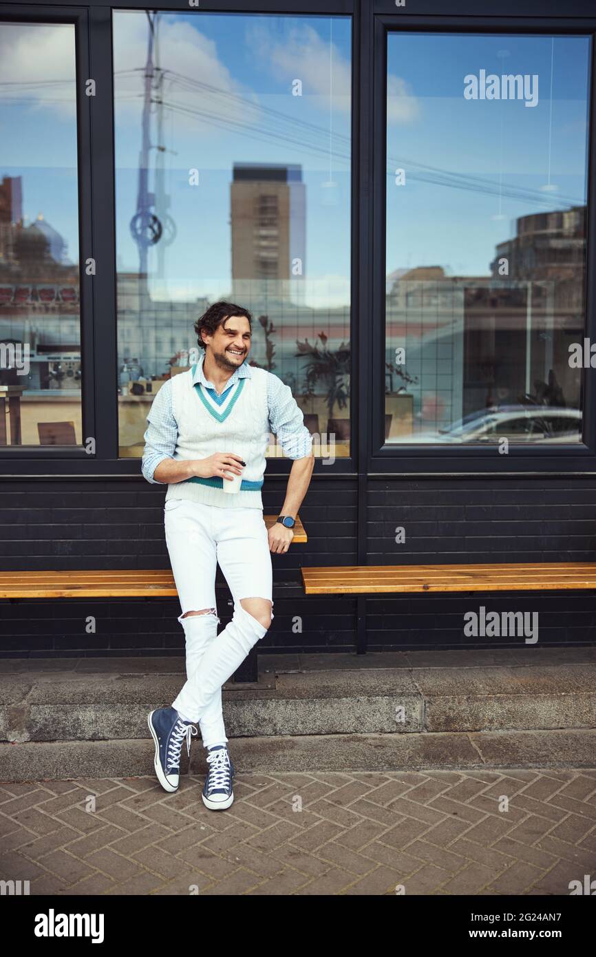 Young man walking on terrace hi-res stock photography and images - Alamy