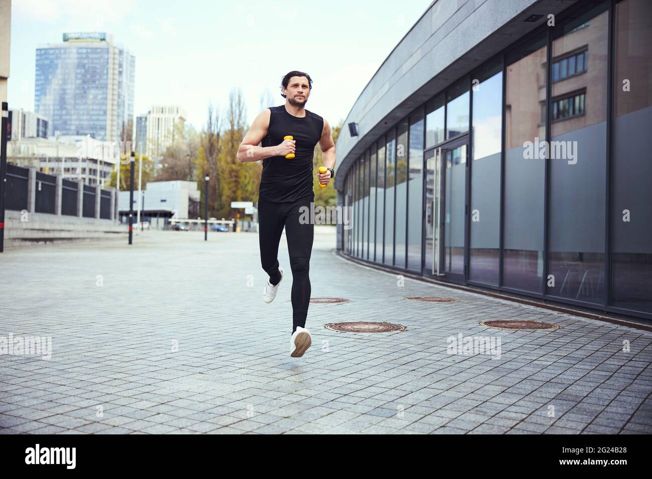Serious male person looking forward during activity Stock Photo - Alamy