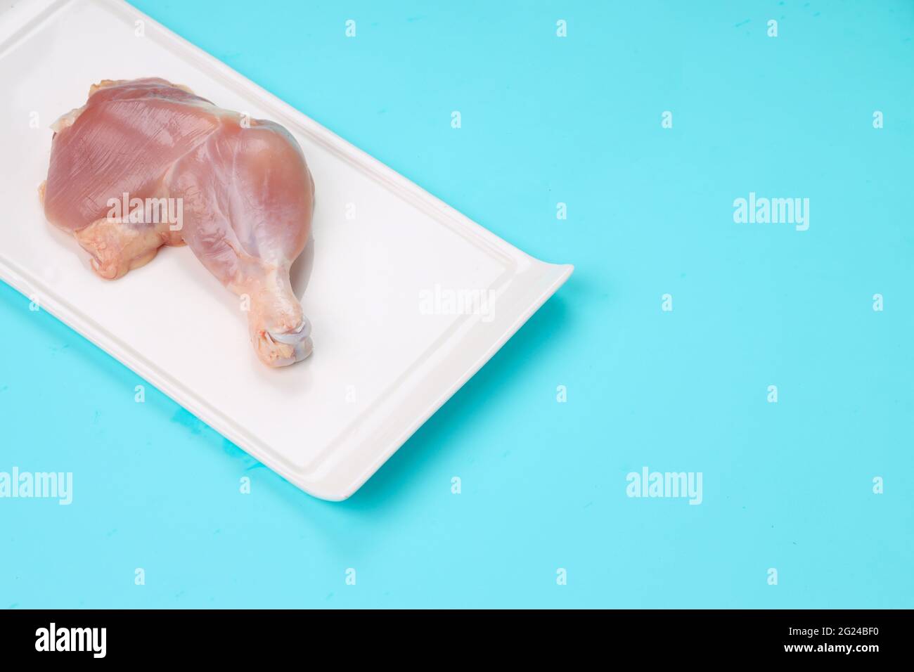 Raw whole chicken leg without skin arranged rectangle shape flat ...