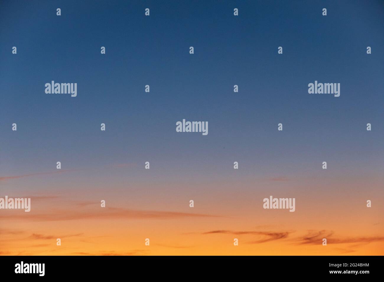 Blue and yellow sunset sky Stock Photo - Alamy