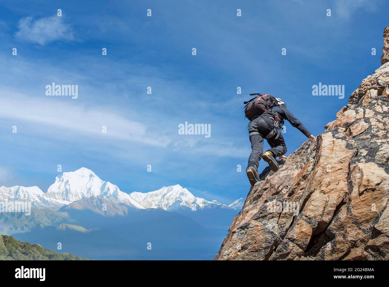 France, Haute Savoie, Chamonix, Mont Blanc, Man climbing rocky wall of ...