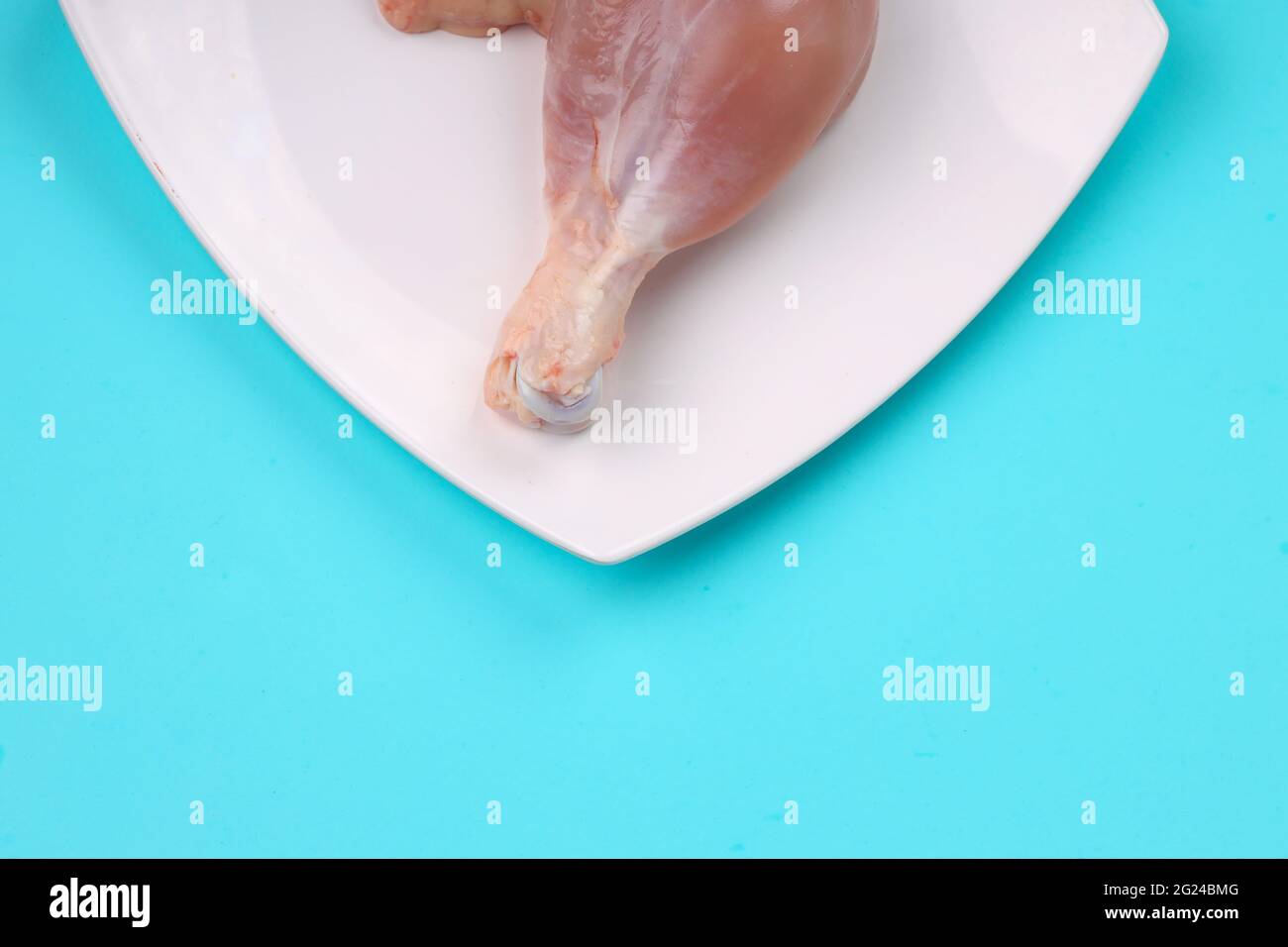 Raw whole chicken leg without skin arranged in a square shape white ...