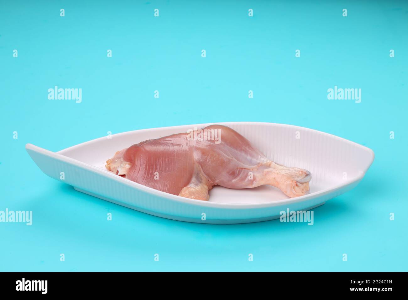 Raw whole chicken leg without skin arranged in a beautiful oval shape ...