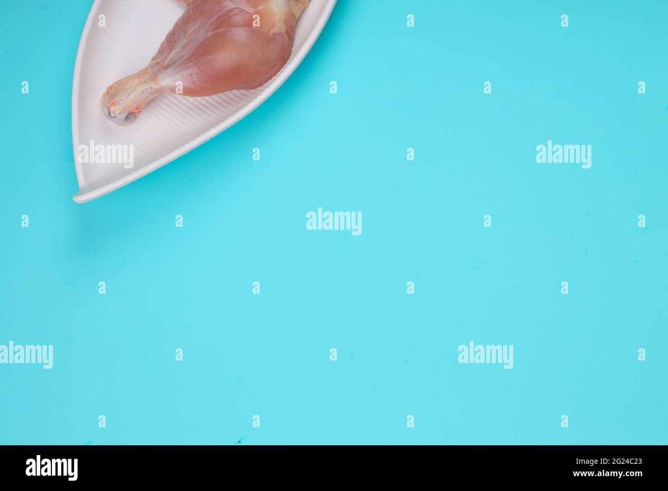 Raw whole chicken leg without skin arranged in a beautiful oval shape ...