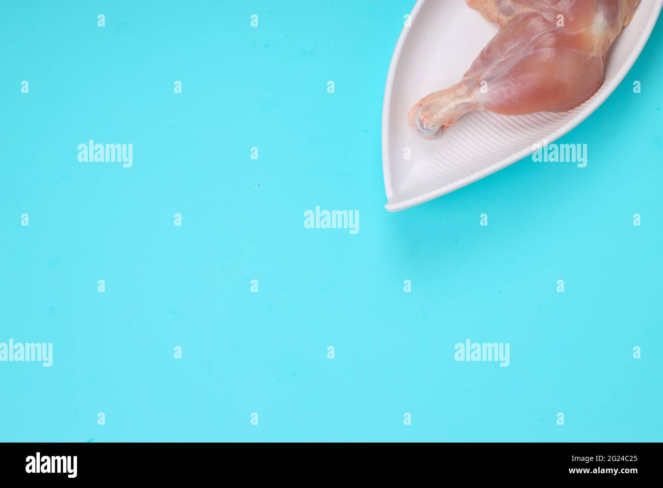 Raw whole chicken leg without skin arranged in a beautiful oval shape ...