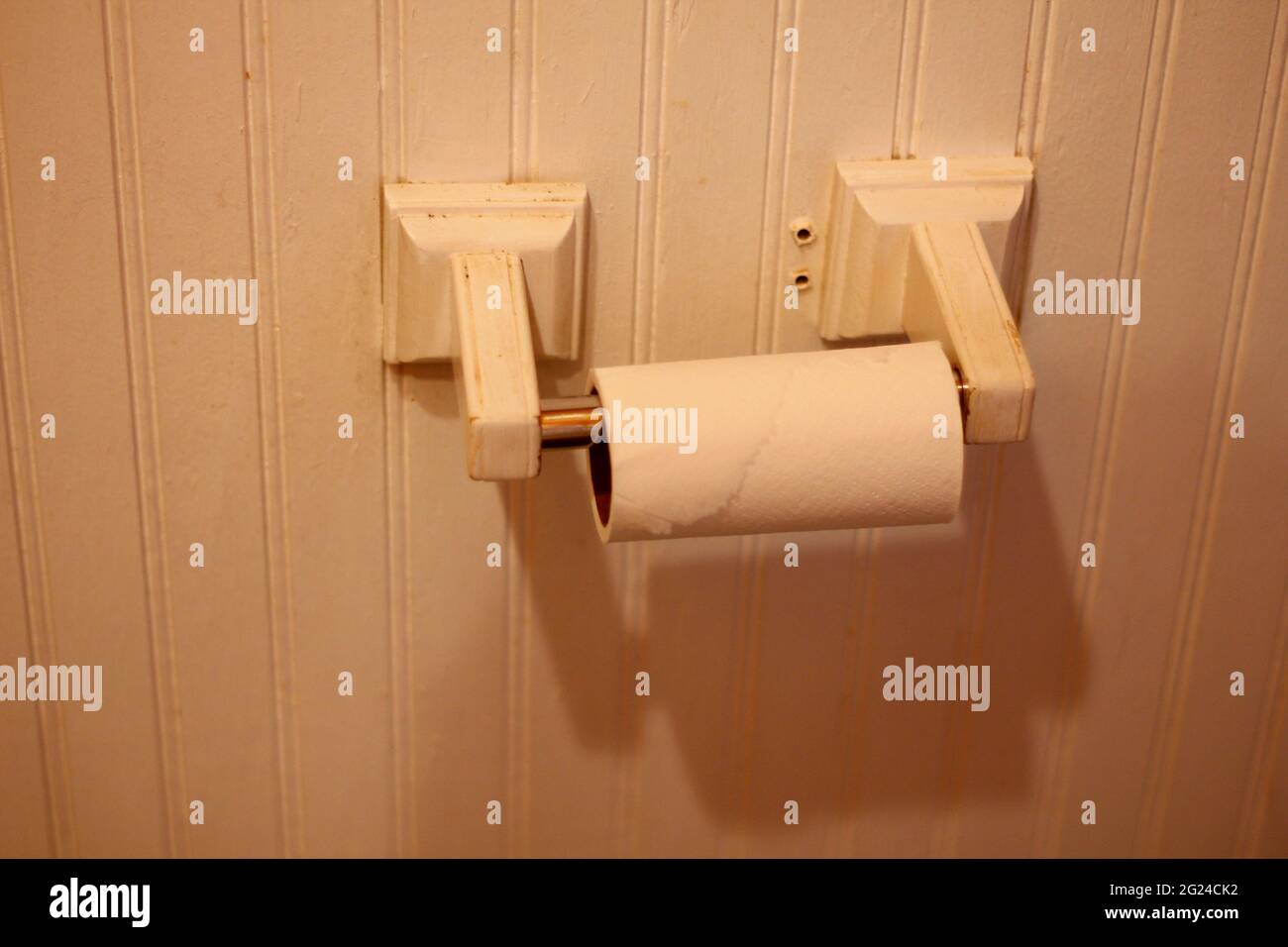 White Toliet Paper Holder with Roll Stock Photo - Alamy