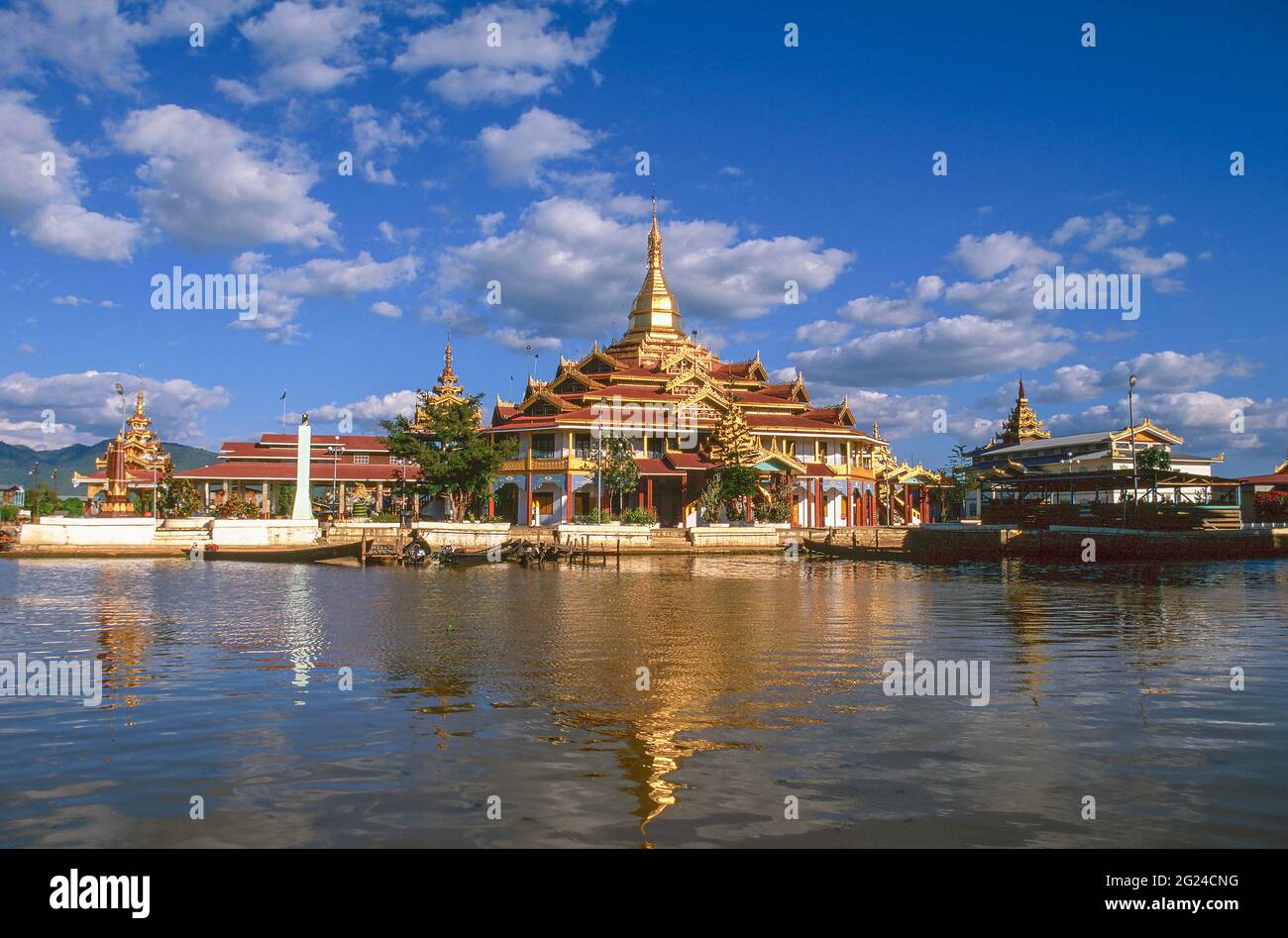 Myanmar, Shan State, Inle Lake, Buddhist temple reflecting in lake ...