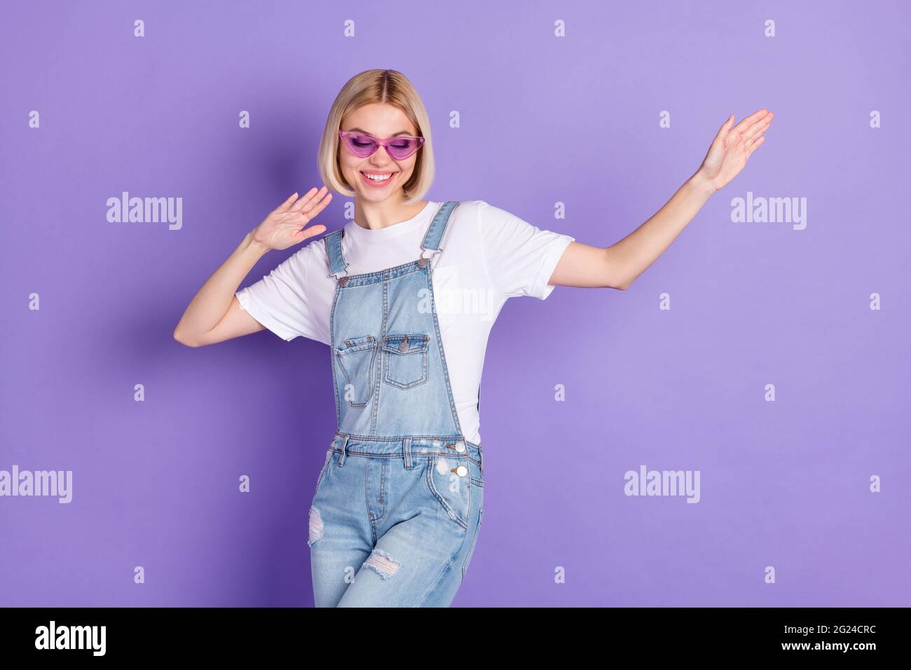 Photo of nice optimistic short hairdo blond lady dance wear spectacles ...