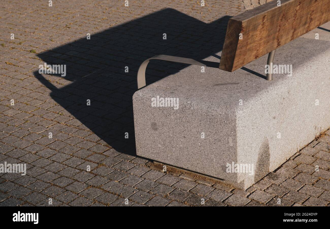 Bench with shadow on the park Stock Photo - Alamy