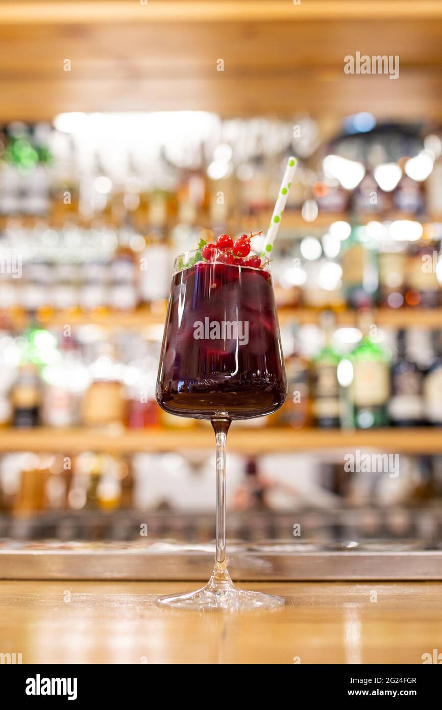summer red cocktail with cranberries on the bar Stock Photo - Alamy
