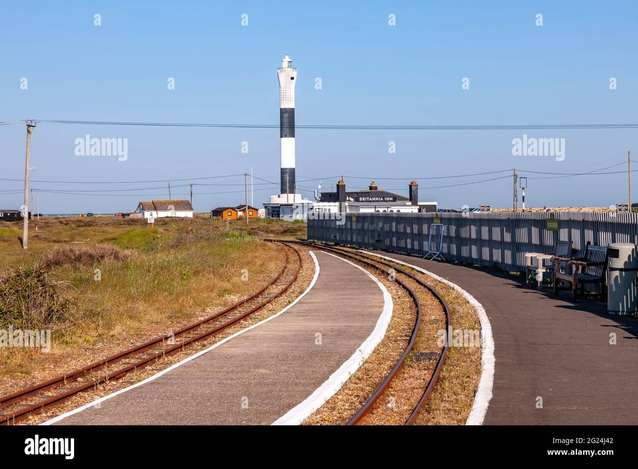 Waiting for the last train to arrive at Dungeness station on the narrow ...
