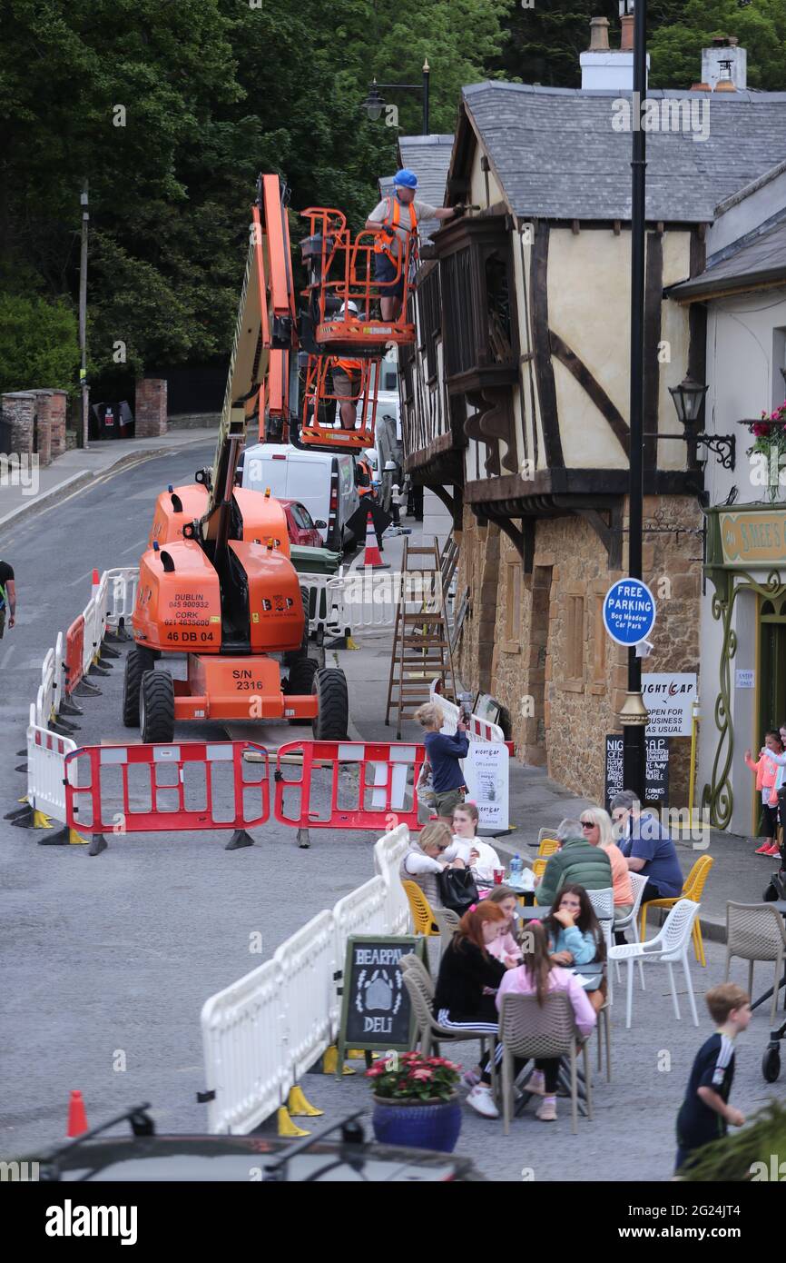 Local people carry on with daily life whilst workers transform ...