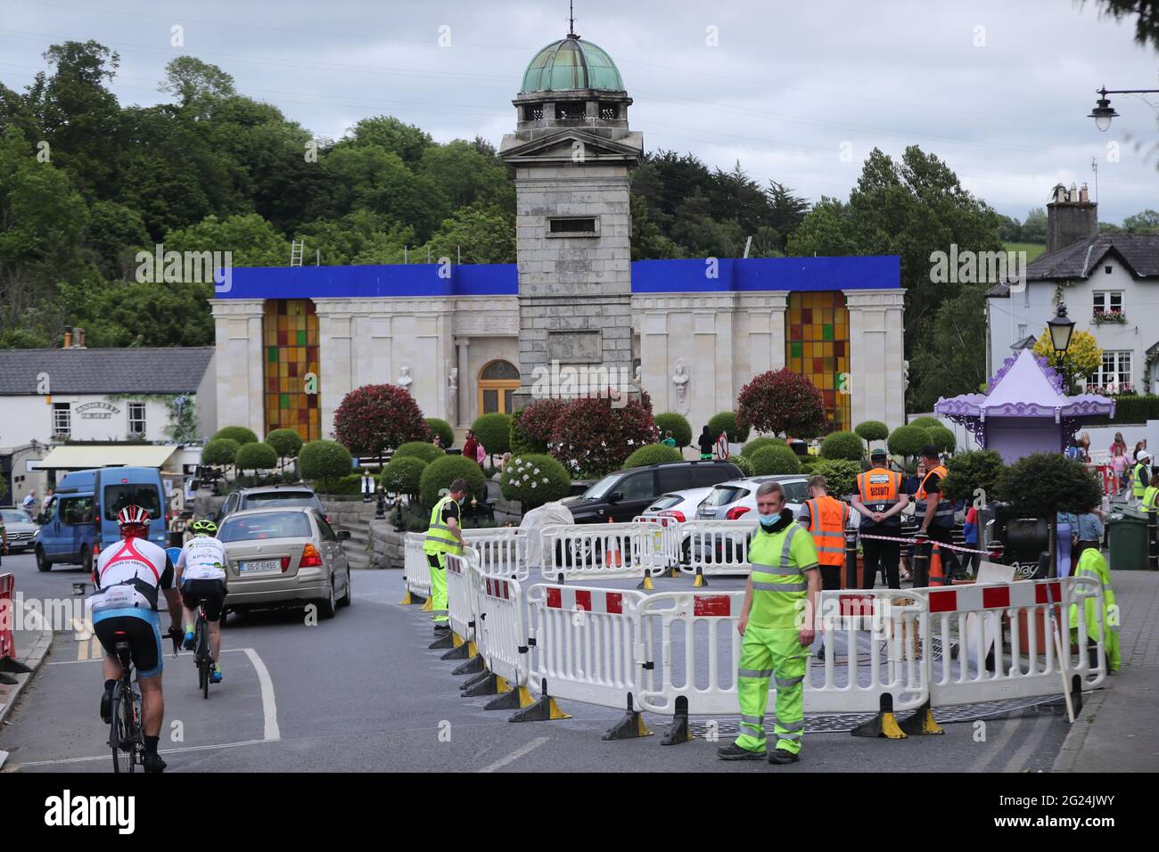 Local people carry on with daily life whilst workers transform ...
