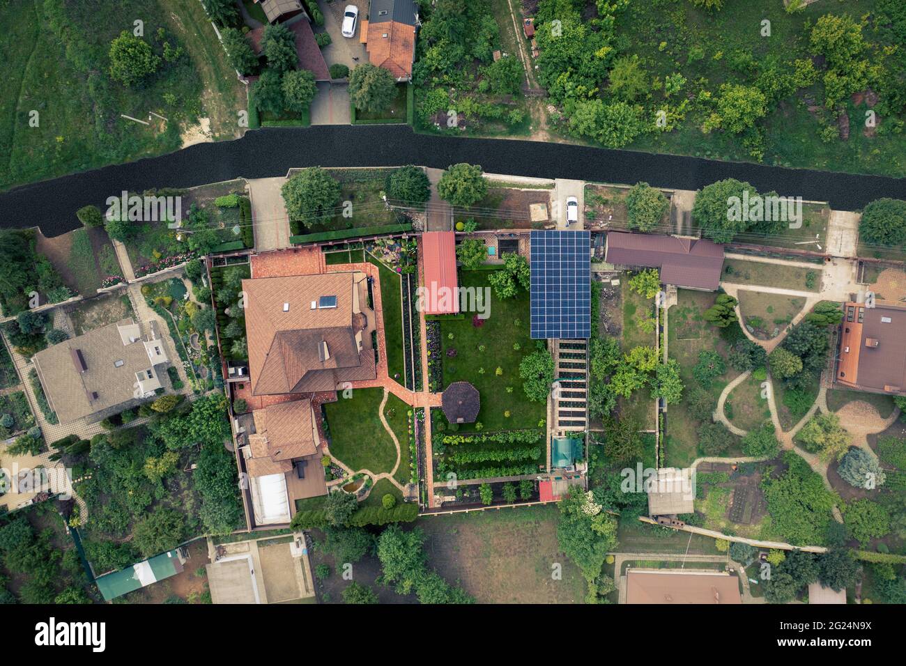 A country house in a beautiful courtyard with a solar power station ...