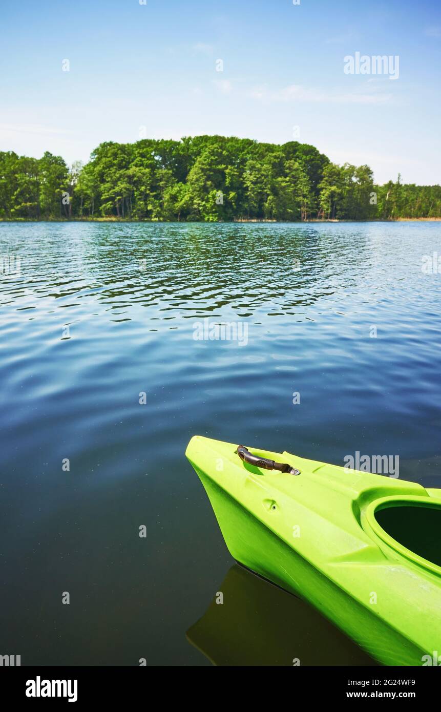Stern of a kayak on a lake, forest in distance Stock Photo - Alamy