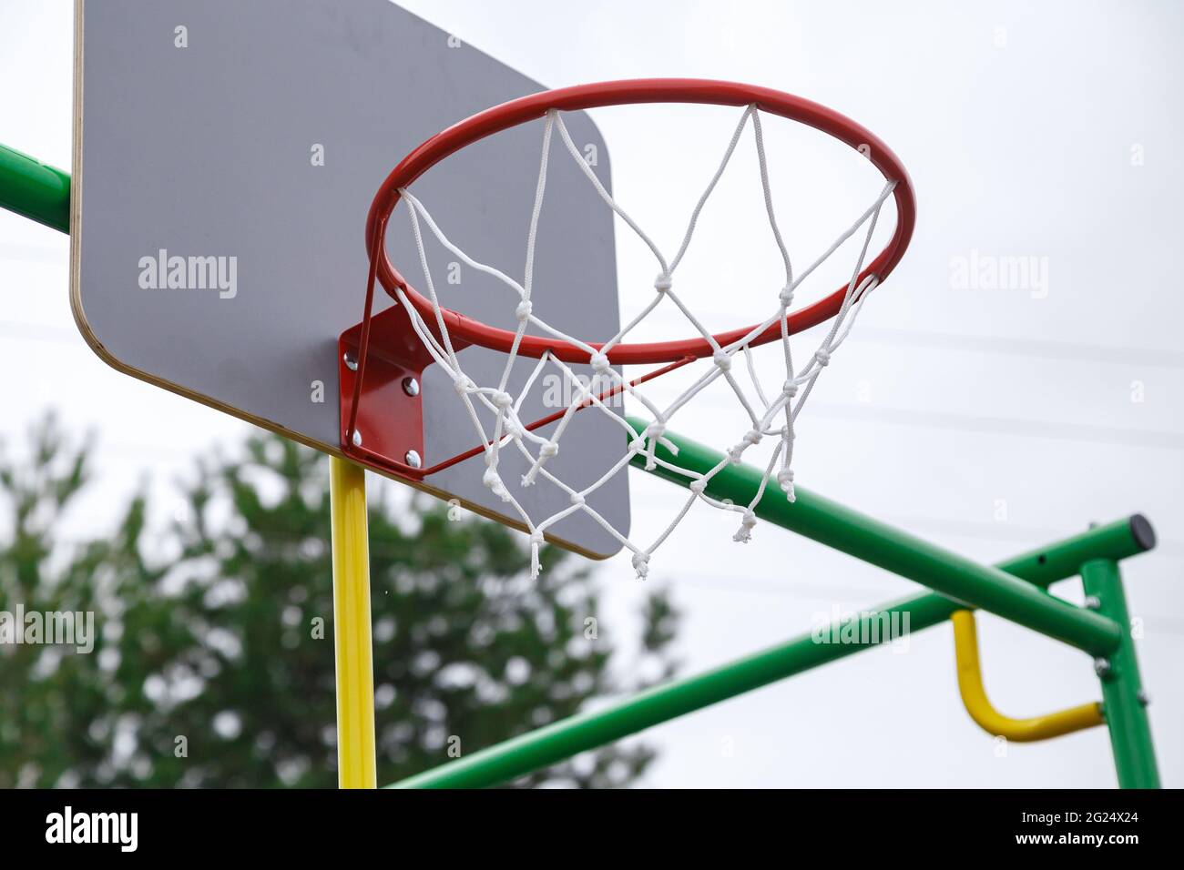 Photo of red basketball ring in cloudy day on the street Stock Photo ...