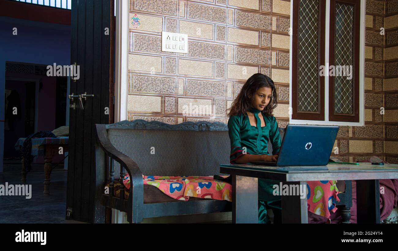 Indian girl studying on laptop hi-res stock photography and images - Alamy