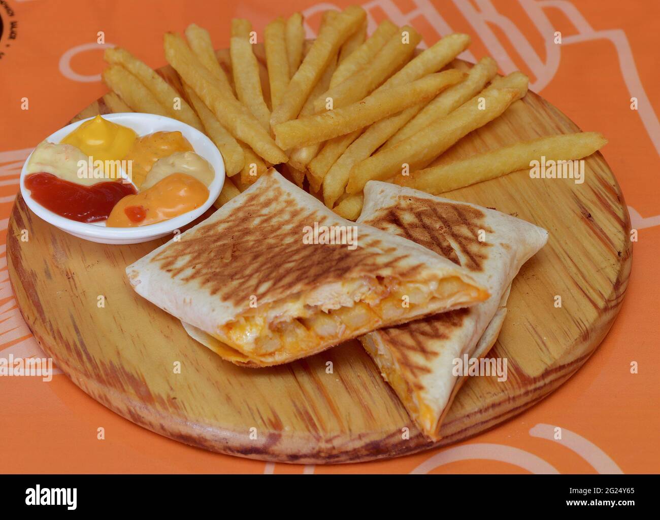 French tacos with chicken. Served with french fries, mayonnaise ...