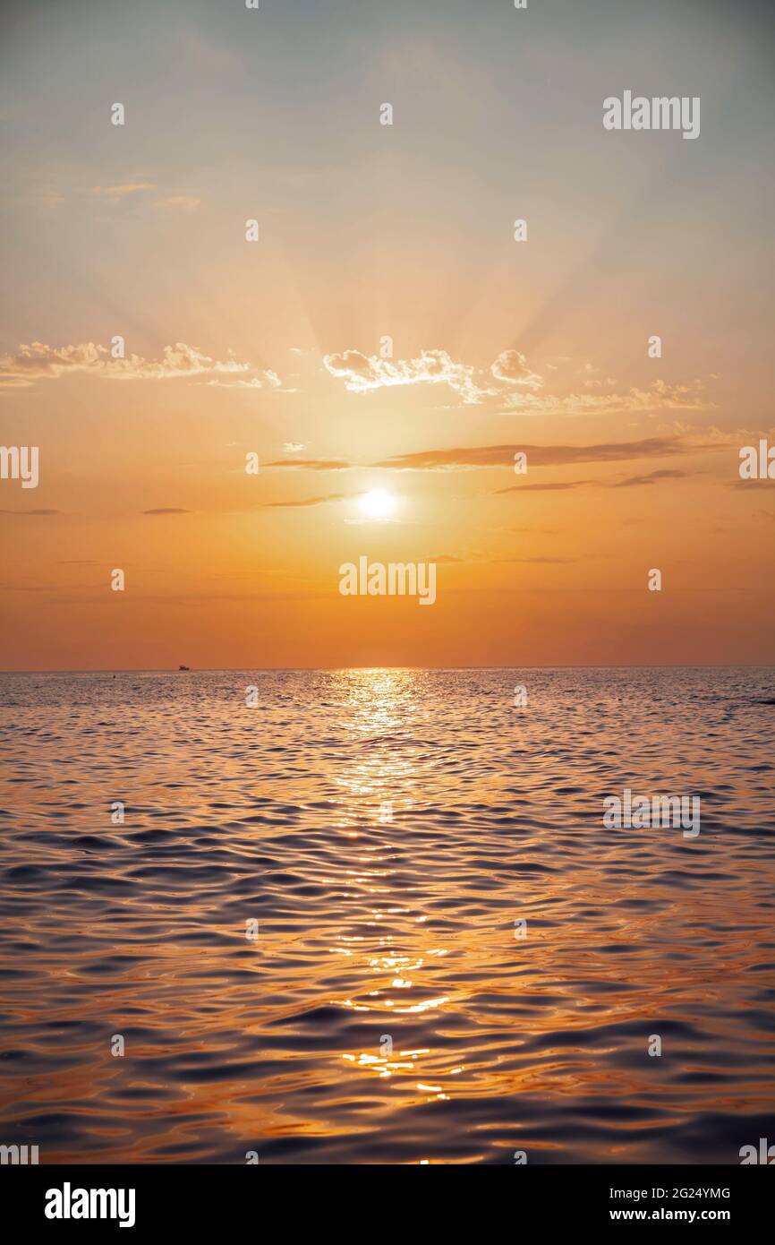 Sun rays over the sea hi-res stock photography and images - Alamy